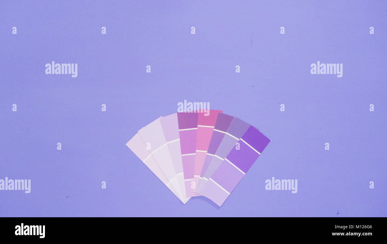 Hand holding paint swatches with shades of violet colors Stock Photo ...