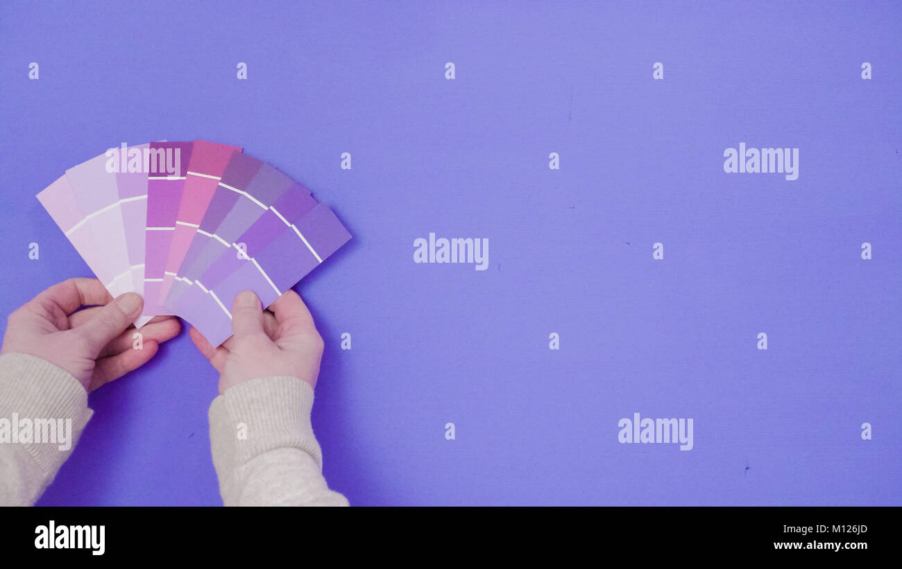 Hand holding paint swatches with shades of violet colors Stock Photo ...