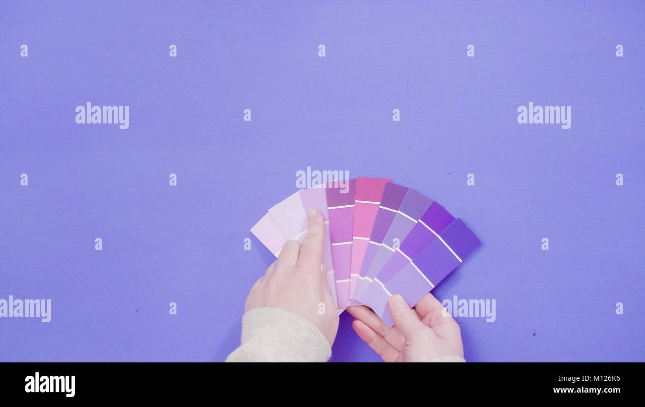 Hand holding paint swatches with shades of violet colors Stock Photo ...