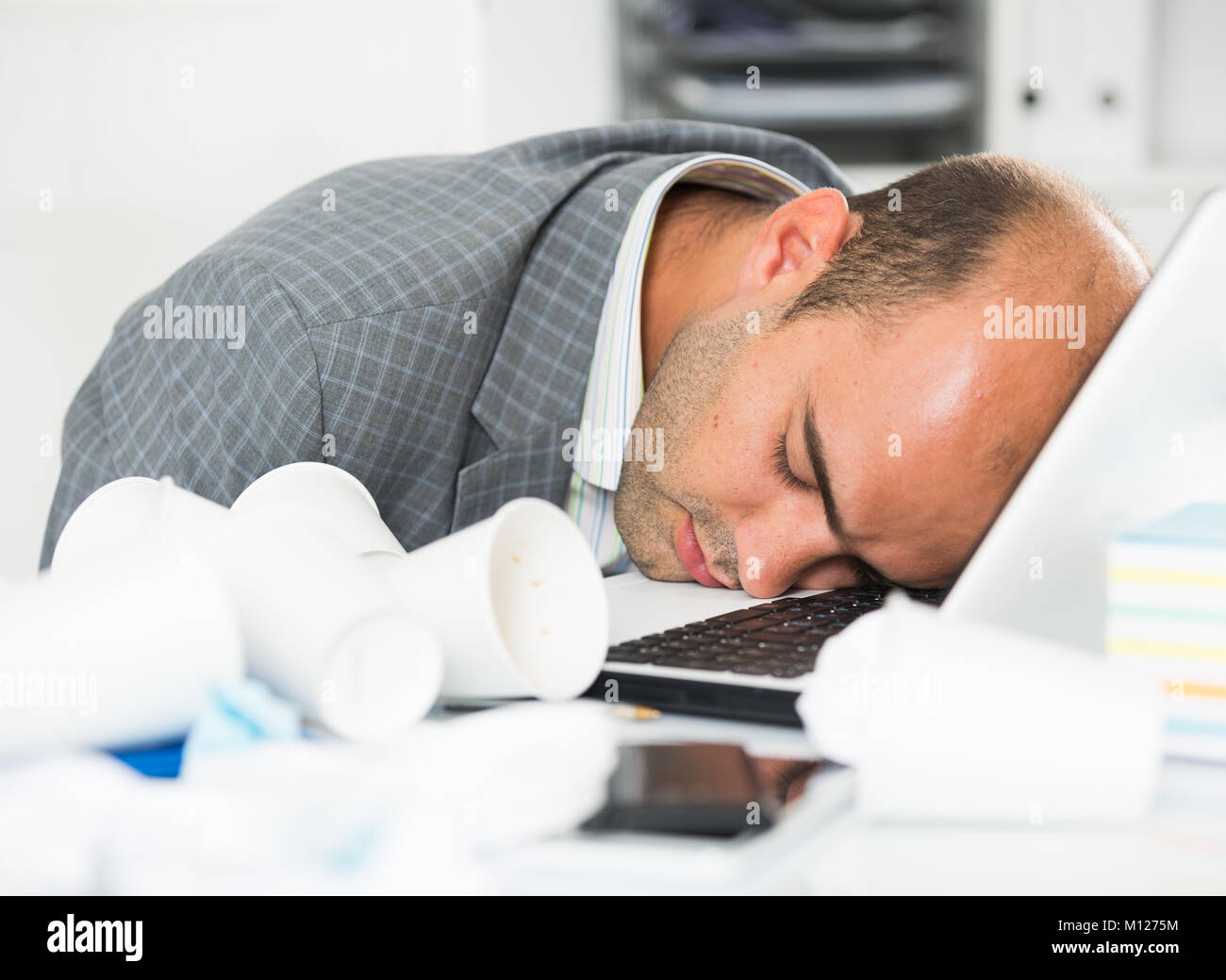 Young sad man tired of working and sleeping in the modern office Stock ...