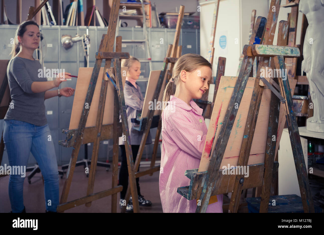happy germany schoolgirls diligently training their painting skills ...