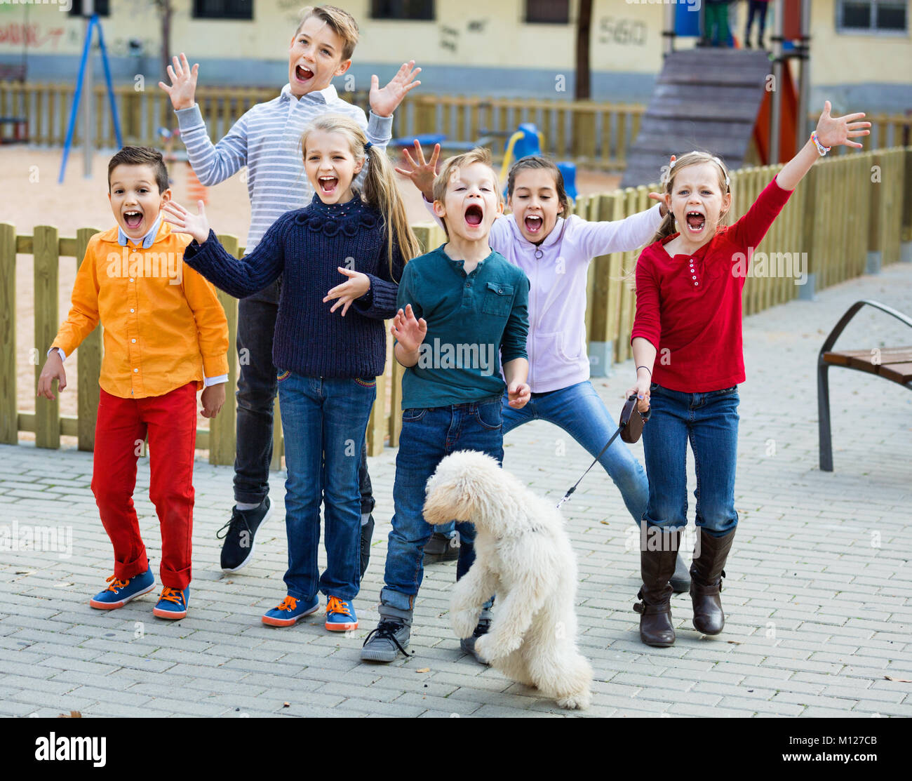 Cheerful laughing kids having fun and jumping up Stock Photo - Alamy