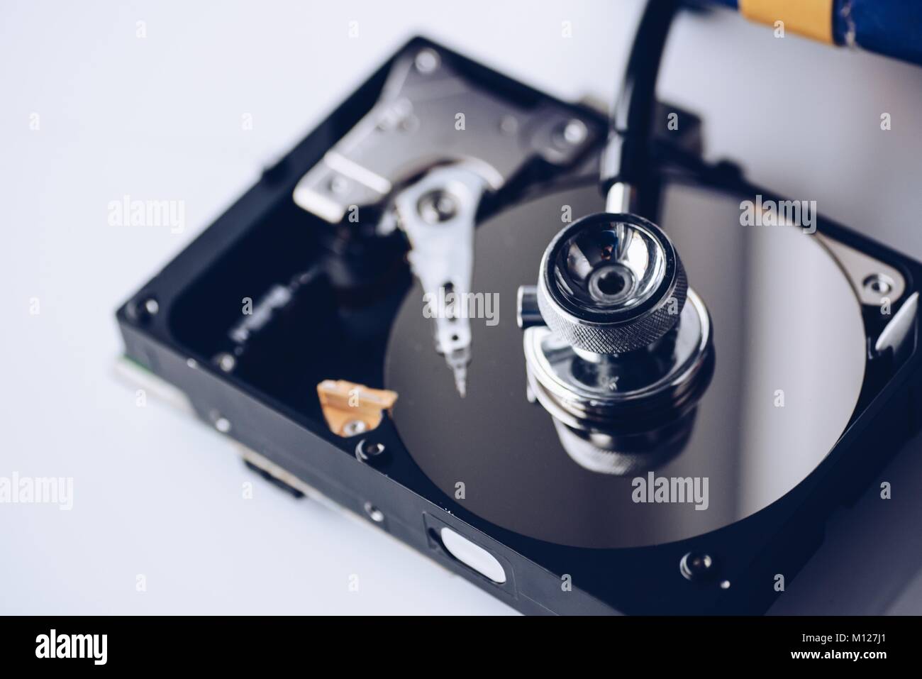 Hard disk drive health. Medical stethoscope on opened hard disk Stock ...