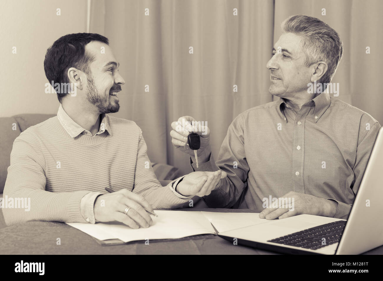 Adult man and manager signed contract car hire at home and hand over ...