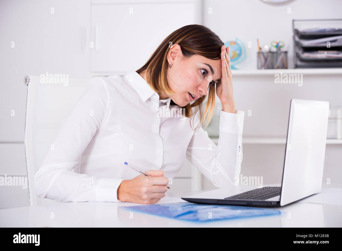 Female employee having complicated issue in project in office Stock ...