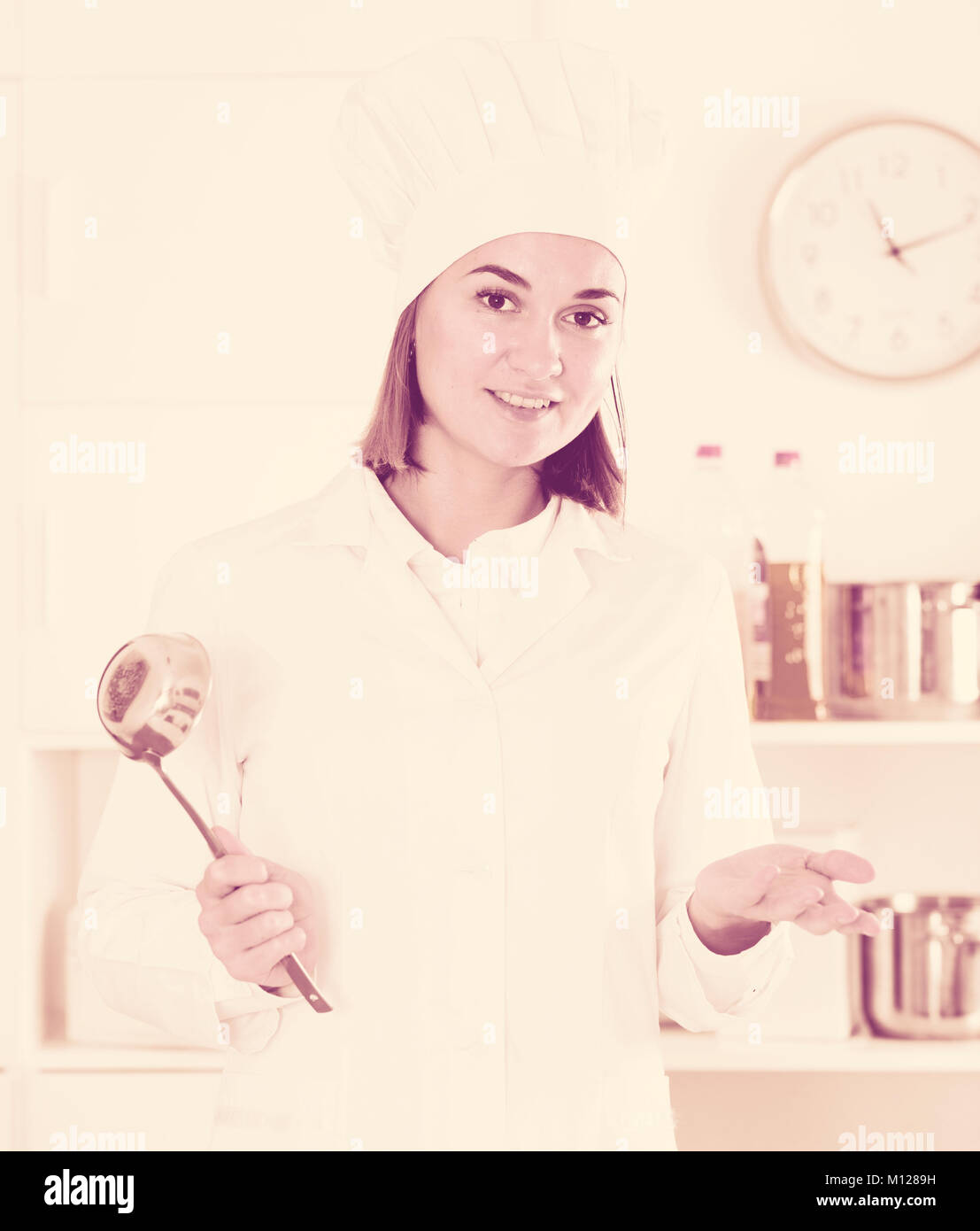 Young female cook preparing delicious food in kitchen Stock Photo - Alamy