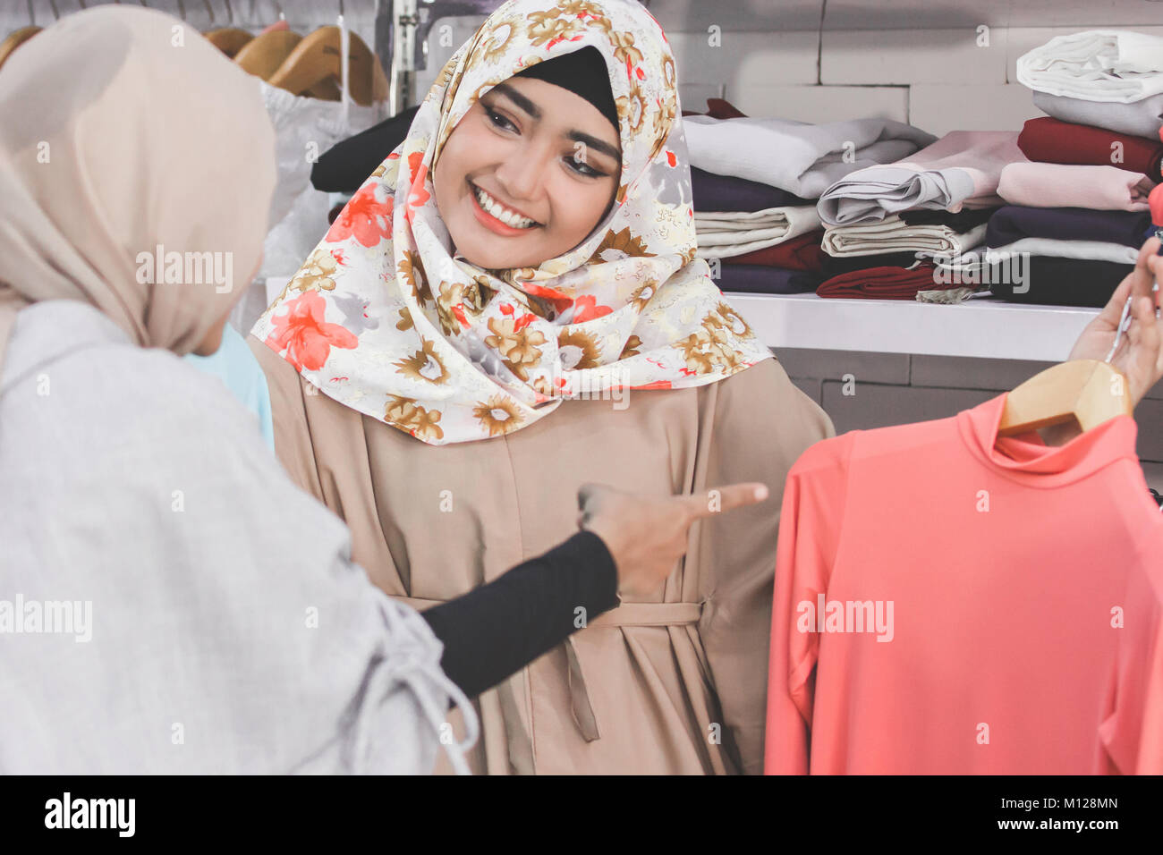 two happy female muslim best friend at fashion store Stock Photo - Alamy