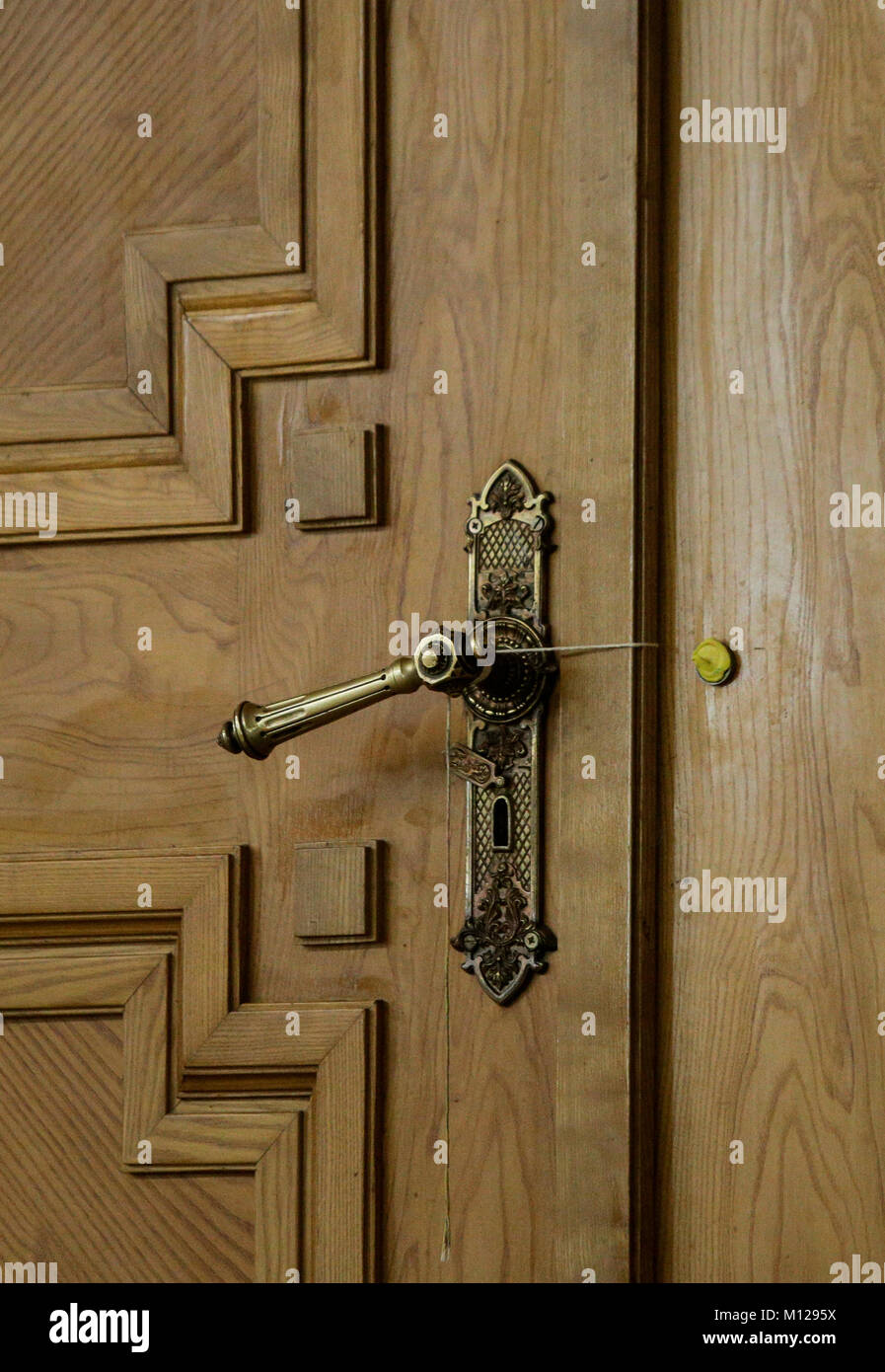 Broken wax seal on wooden door Stock Photo - Alamy