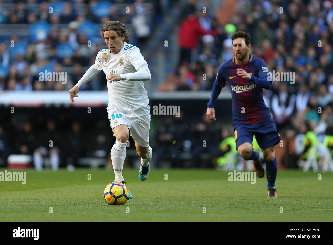 MADRID, SPAIN. December 23, 2017 - Luka Modric with the ball and Messi ...