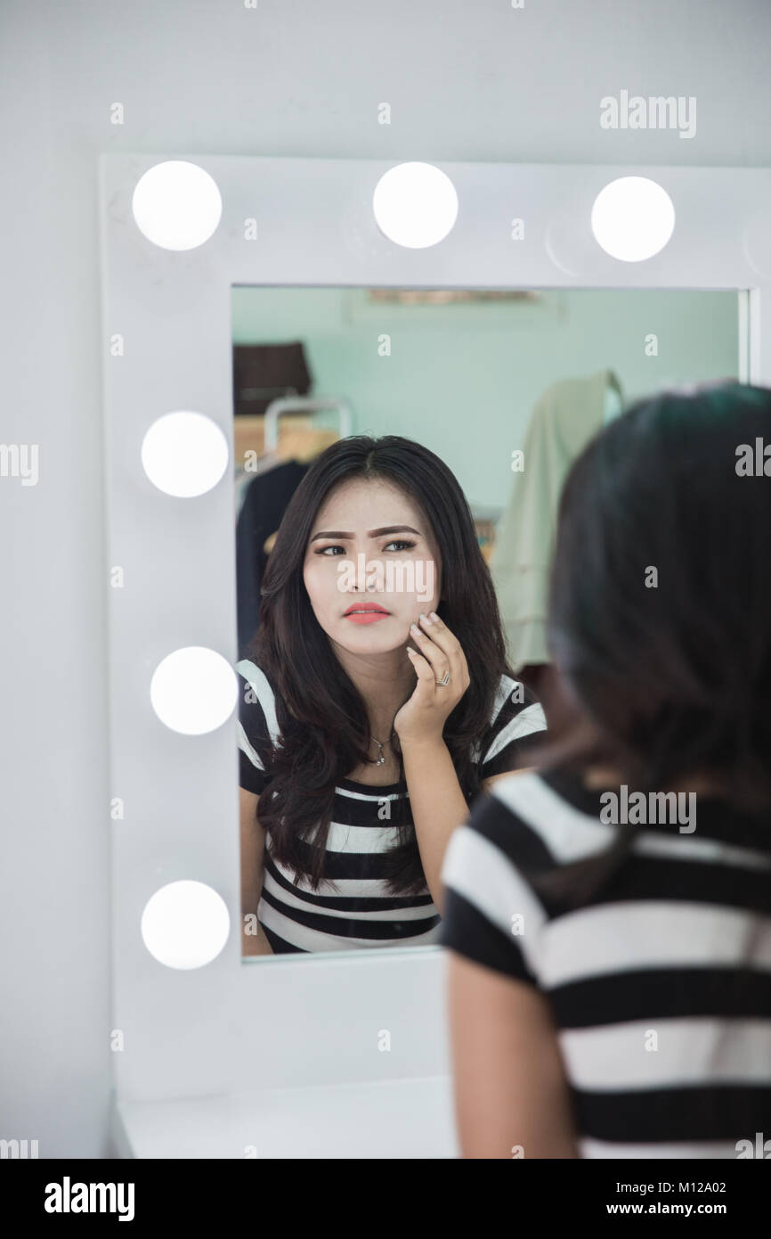 Happy sad woman mirror hi-res stock photography and images - Alamy