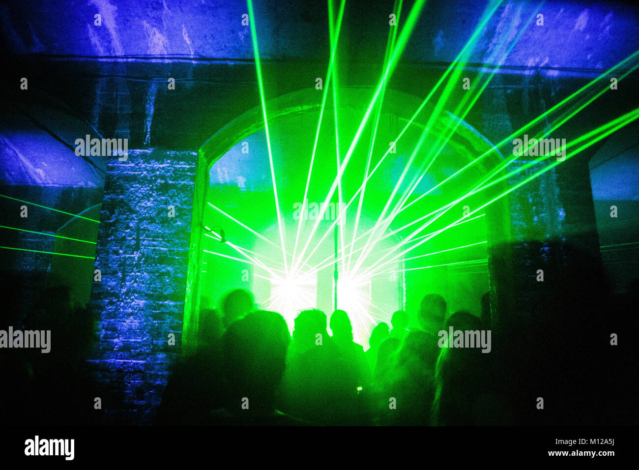 Music fans attend an underground techo rave Stock Photo - Alamy