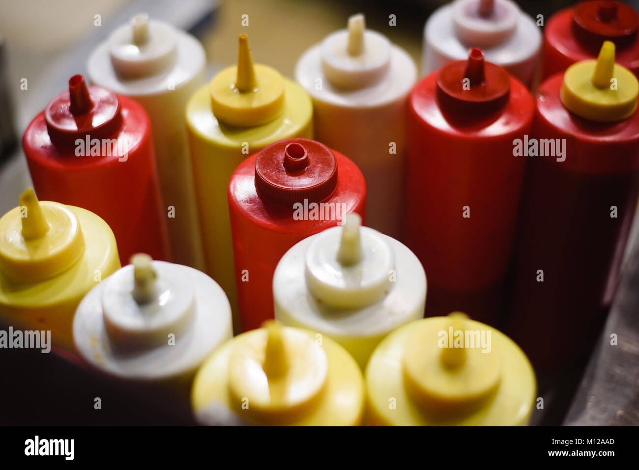 condiments of mustard, mayonnaise, ketchup and hot sauce on a hot dog ...