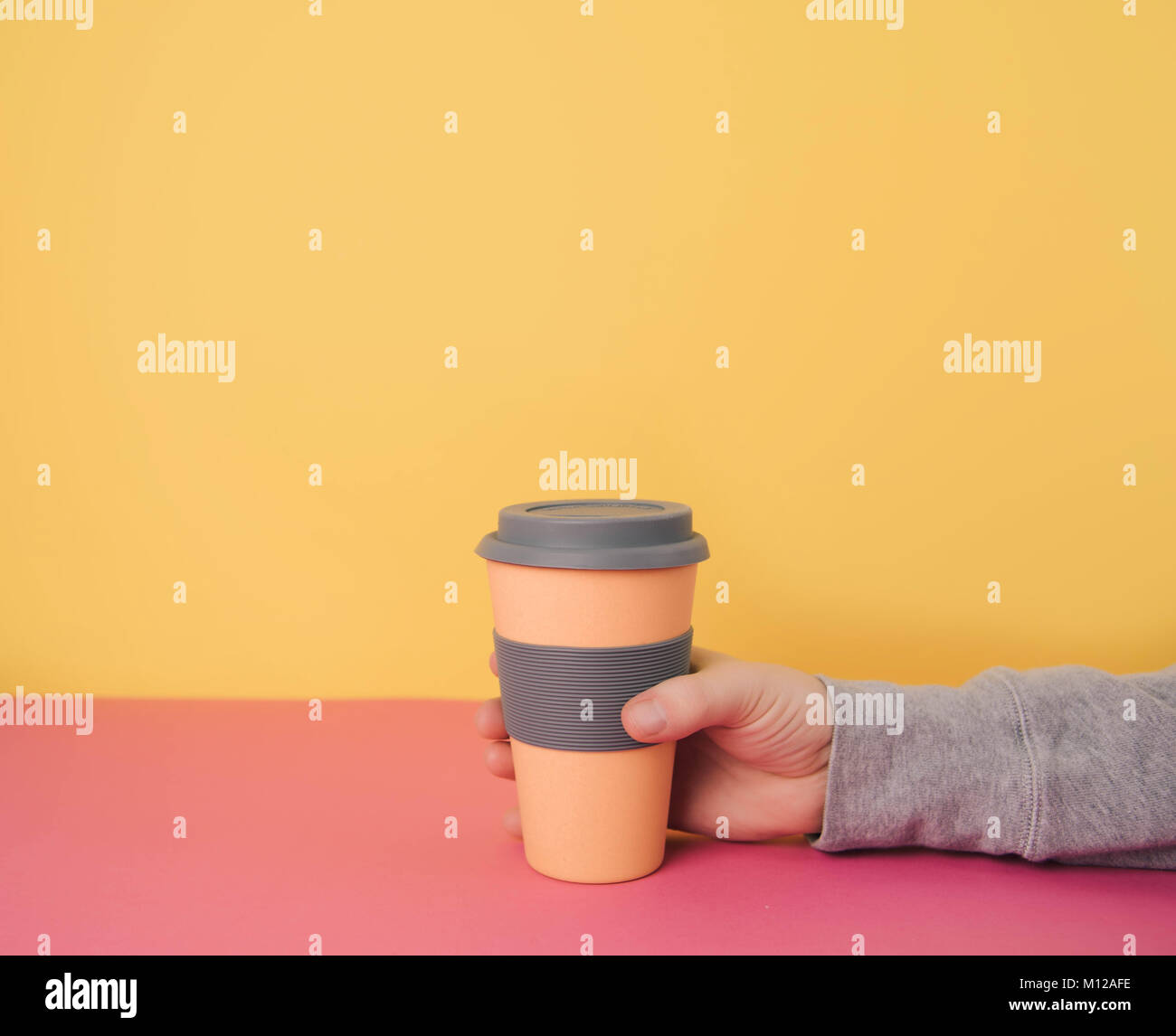 Hand holding take away coffee cup Stock Photo - Alamy