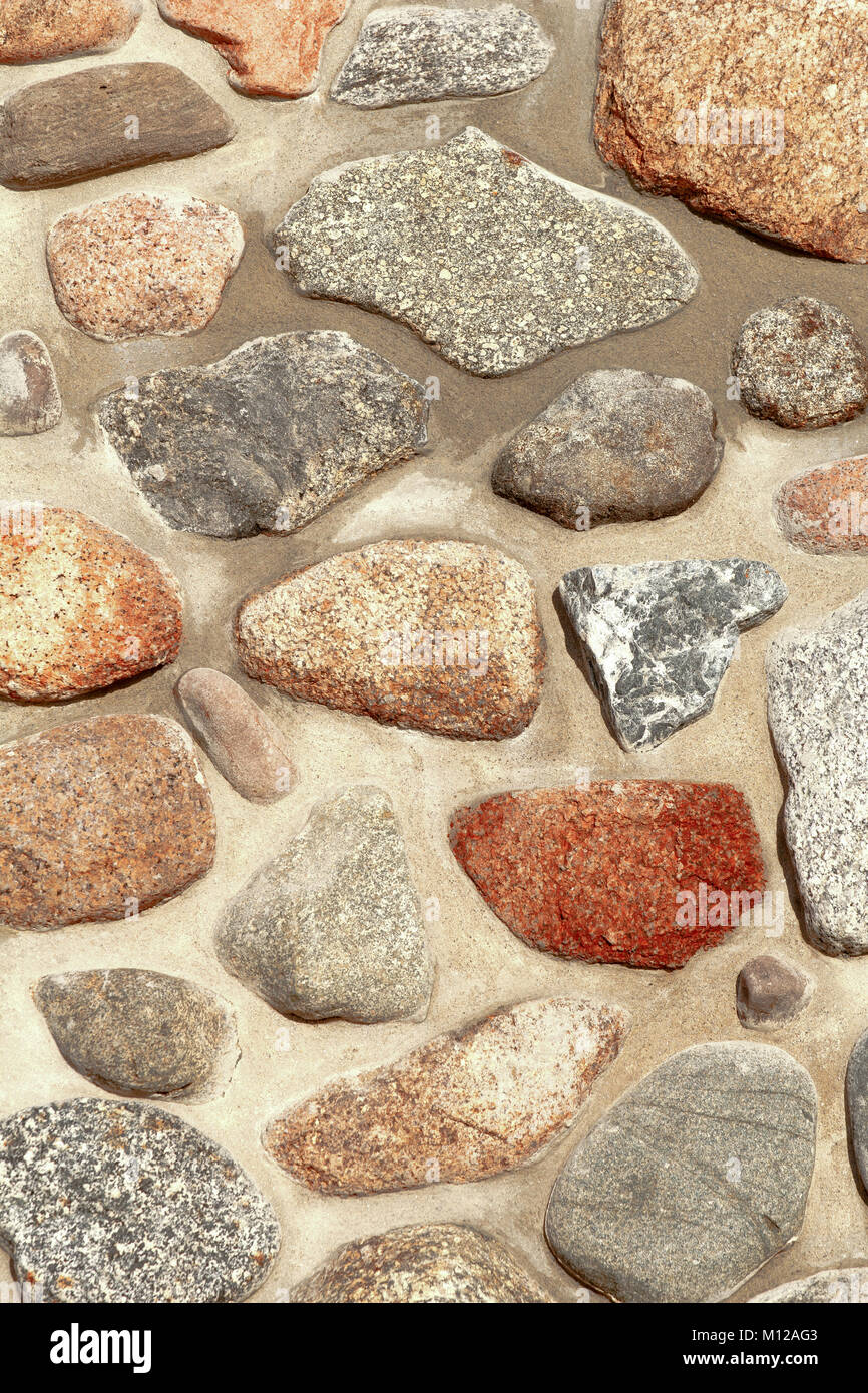 Cemented rockwork facade background Stock Photo - Alamy