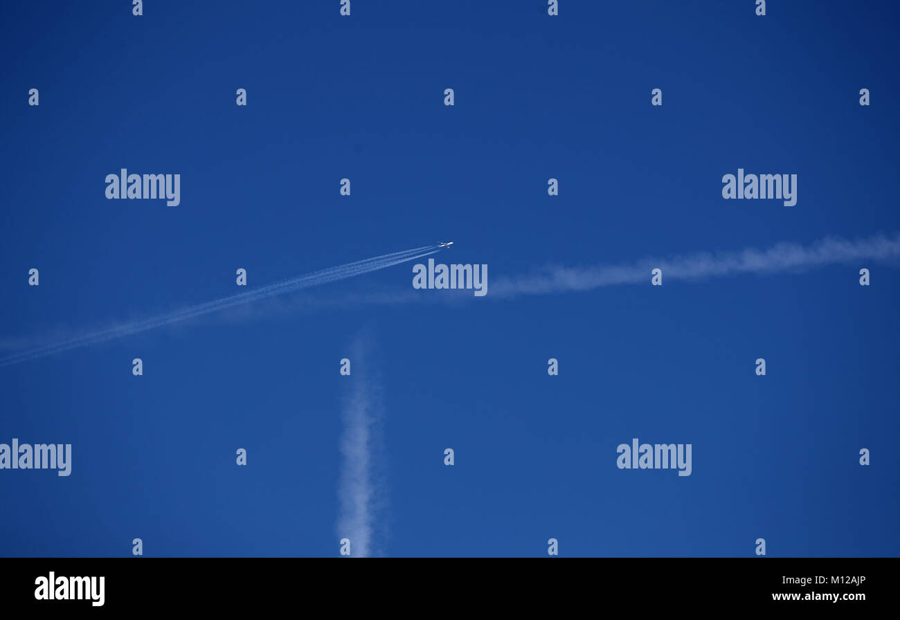 Plane vapor trails in the sky above Woking, Surrey Stock Photo - Alamy