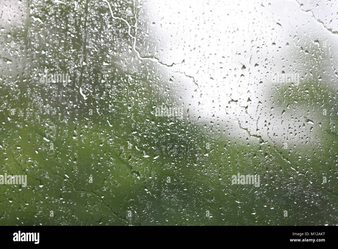 Waterdrops on the window on a rainy day Stock Photo - Alamy