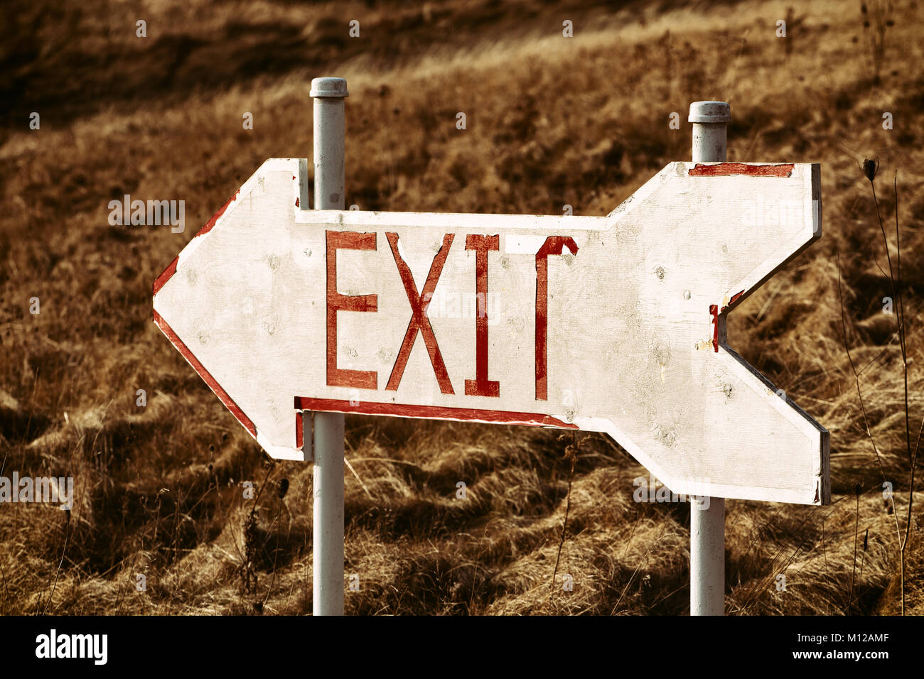 Old and weathered outdoor exit sign Stock Photo - Alamy