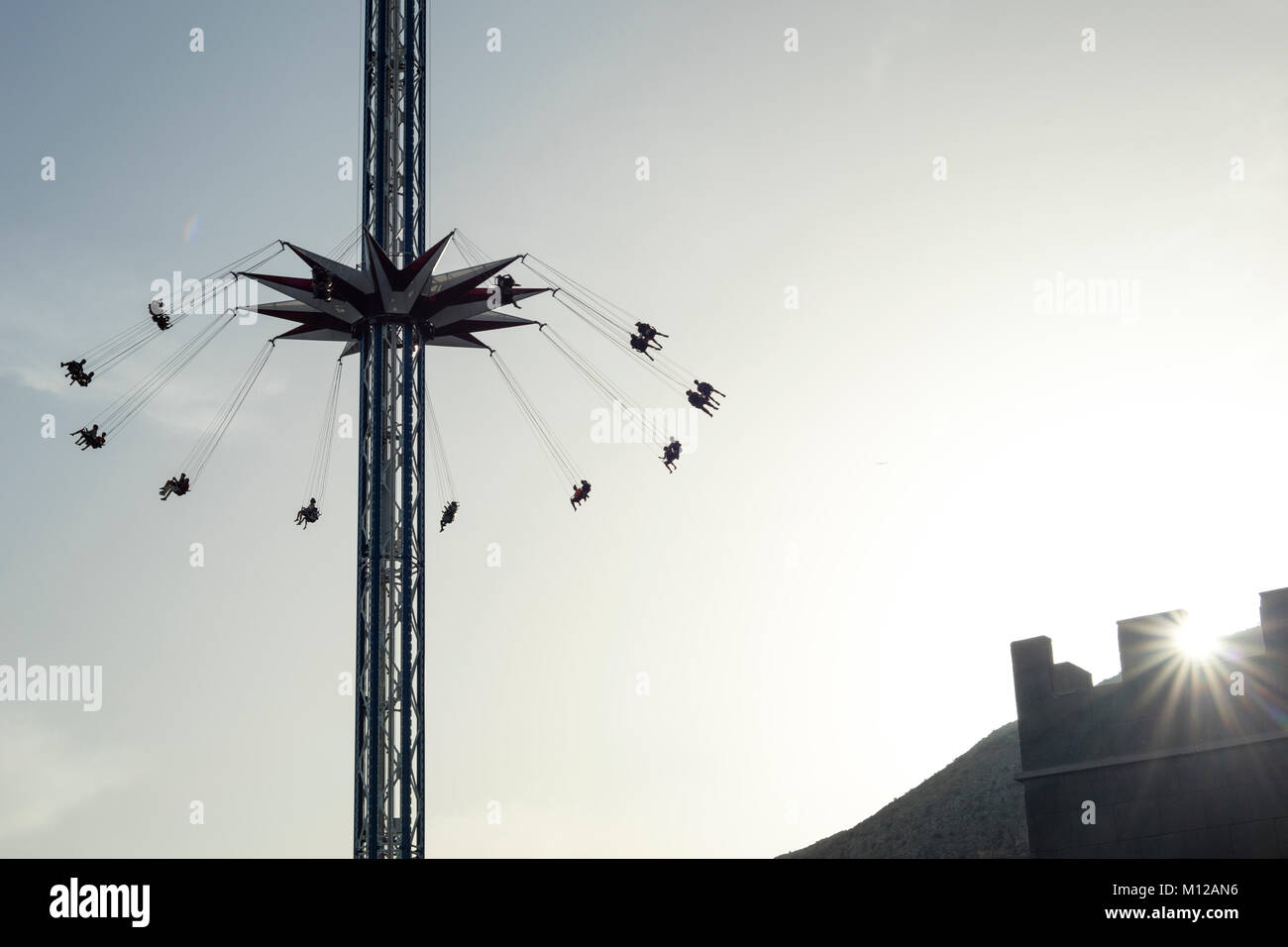 People having fun on huge carousel with sky at the backgrund Stock ...