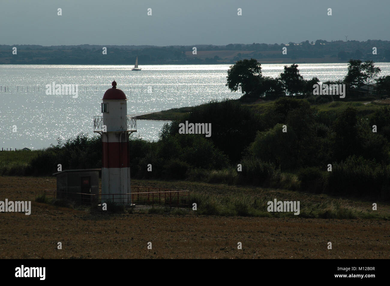 Coast landscape with a lighthouse Stock Photo - Alamy