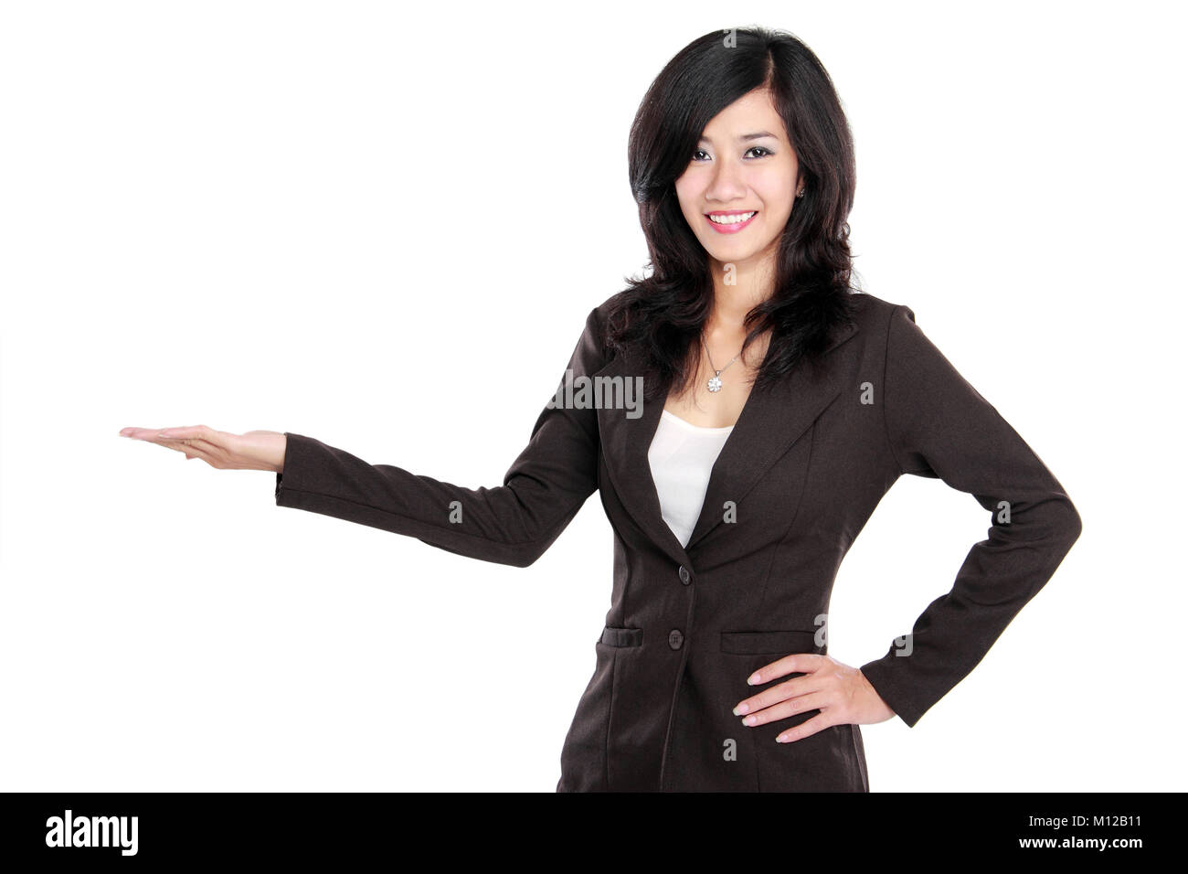 Beautiful business woman presenting something with her hand, isolated ...