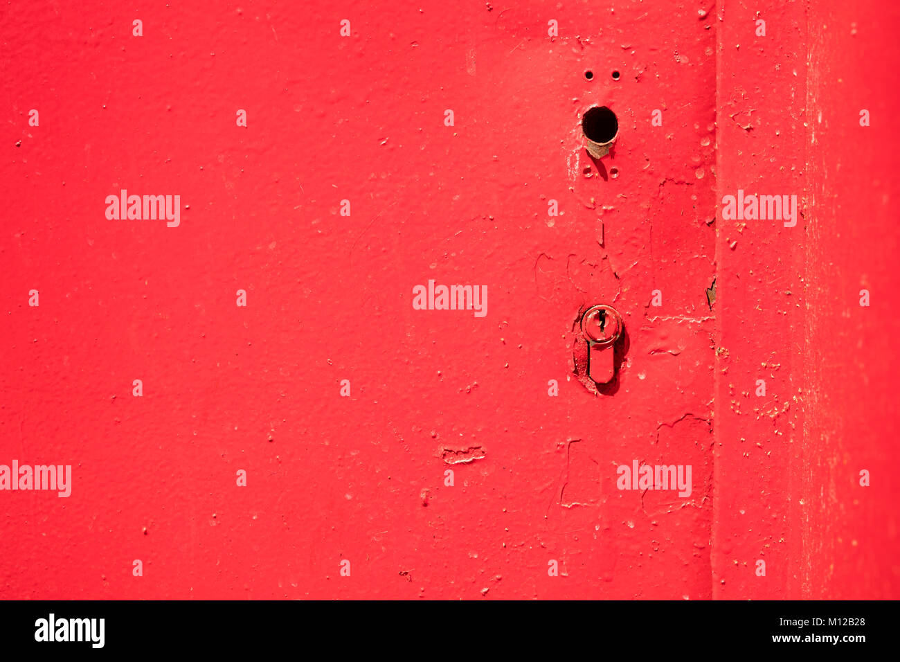 Metallic red door and lock Stock Photo - Alamy