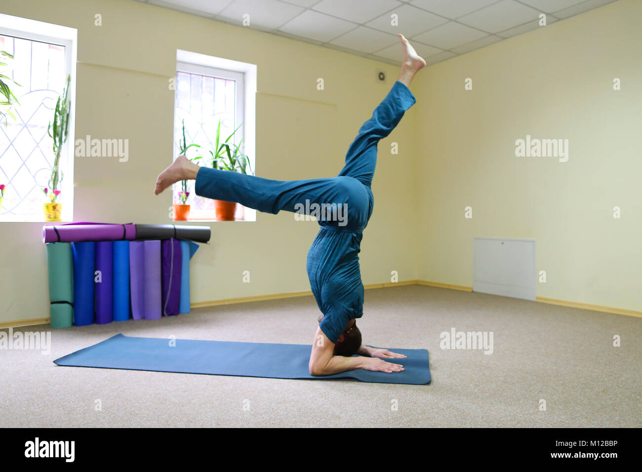 Beautiful young American performs asanas from yoga Stock Photo - Alamy
