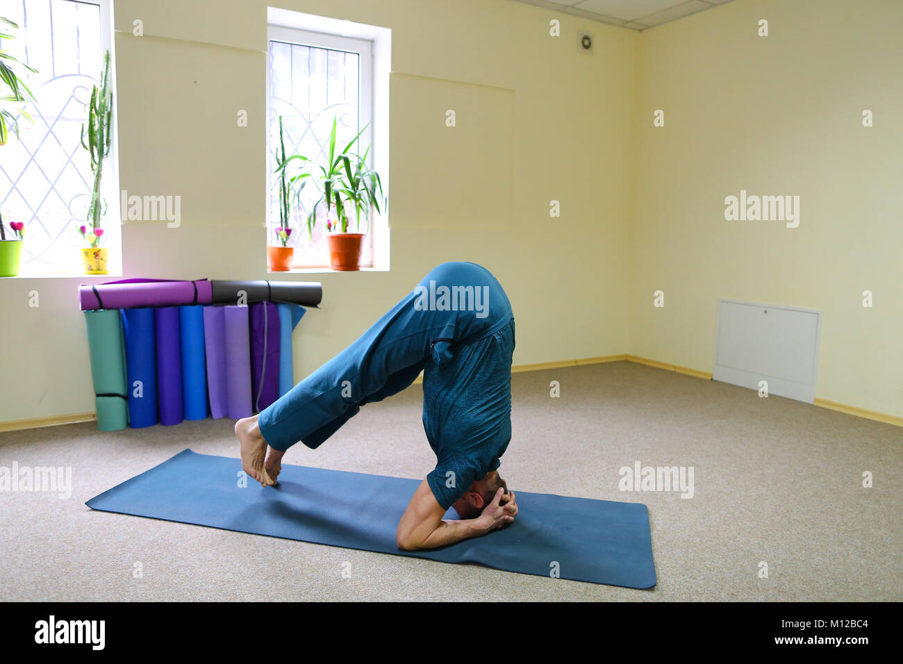 Beautiful young American performs asanas from yoga Stock Photo - Alamy