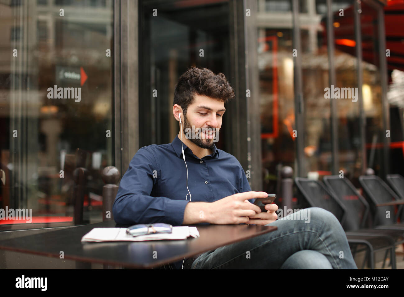 Boy talking with girlfriend by smartphone video call and earphon Stock ...