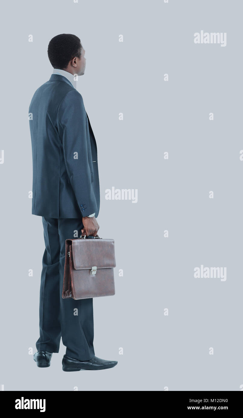 African American business man from the back looking at something ...