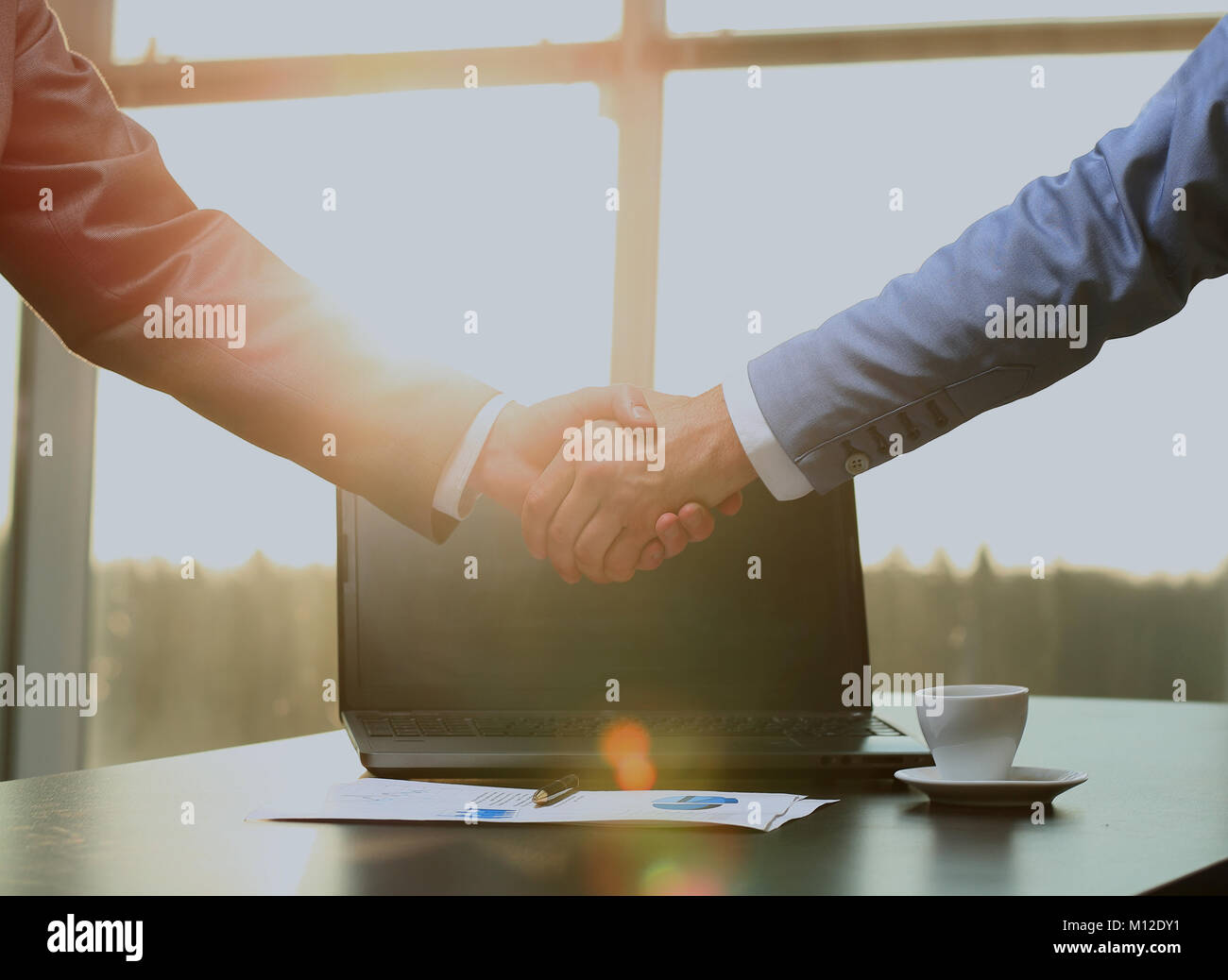 Business handshake. Morning at the office Stock Photo - Alamy