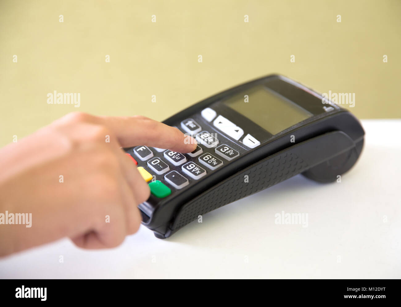 A portrait of EDC ( electronic Data Capture) machine, hand pressing ...