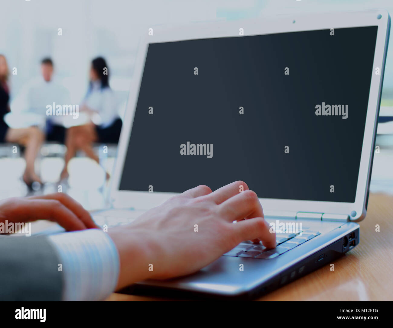 Person Typing on a modern laptop in an office Stock Photo - Alamy