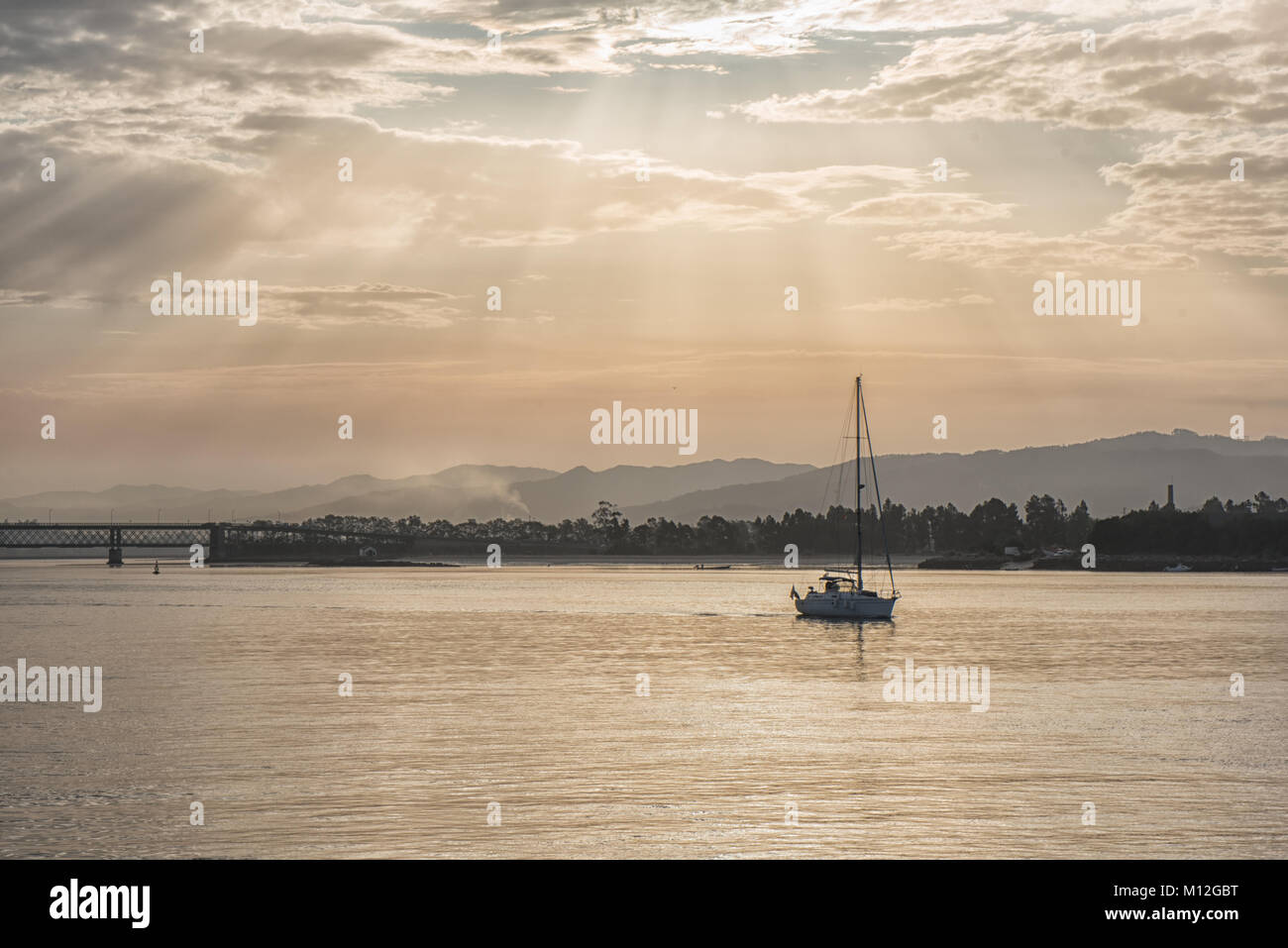 Boat sailing at dawn along the Lima river, Viana do Castelo, Portugal ...