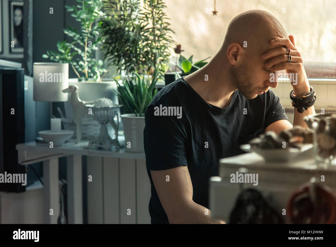 Young handsome man feeling depressed and sad Stock Photo - Alamy