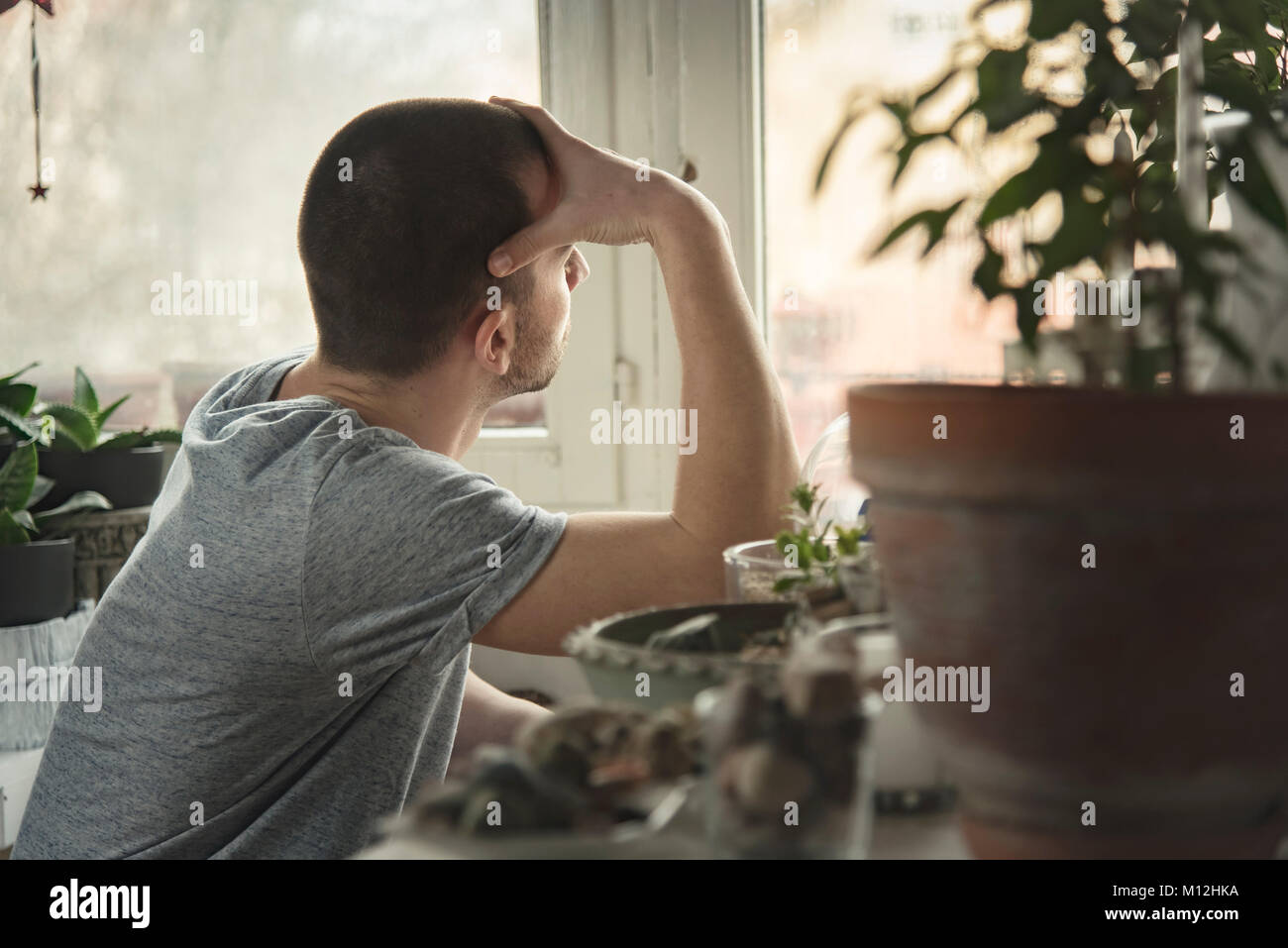 Young handsome man feeling depressed and sad Stock Photo - Alamy