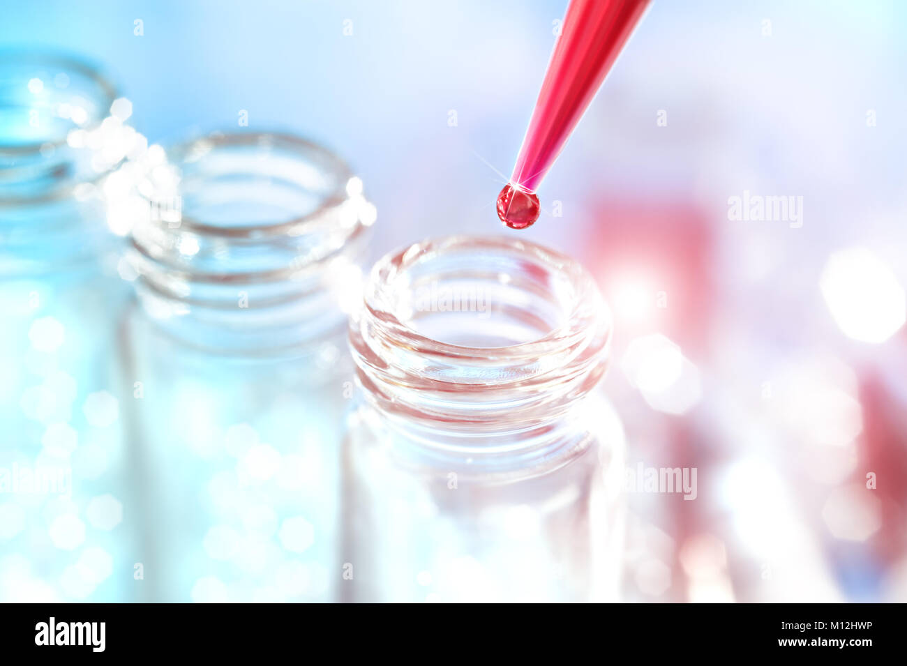 Pipette with drop of red sample. Scientific concept image Stock Photo ...