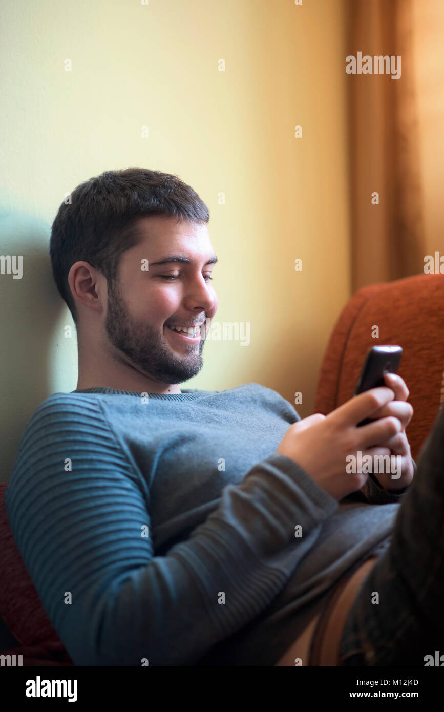 Man using his cell phone Stock Photo - Alamy
