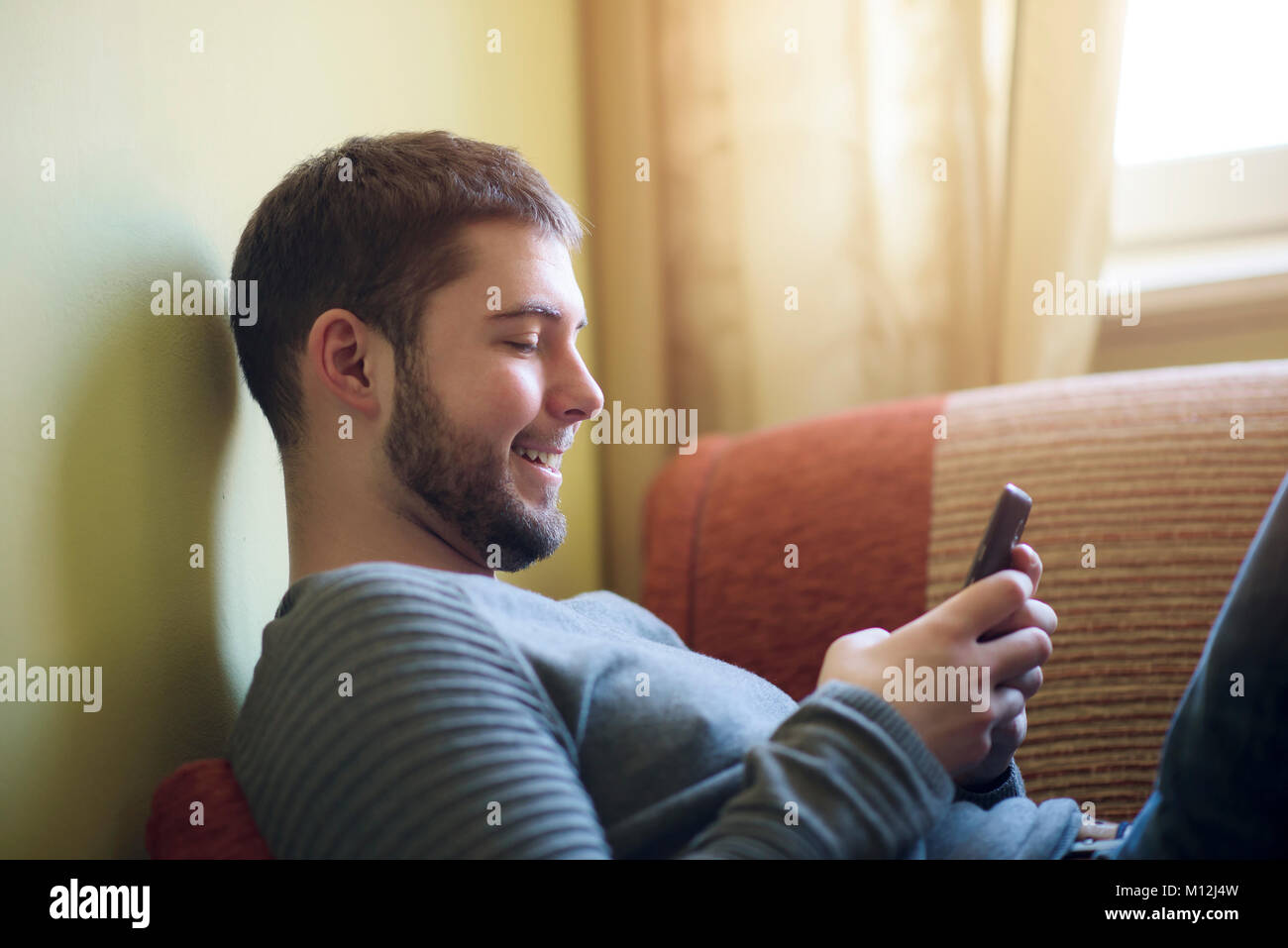 Man using his cell phone Stock Photo - Alamy