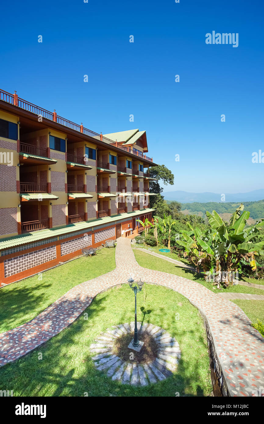 Beautiful hotel in the mountain blue sky background Stock Photo - Alamy