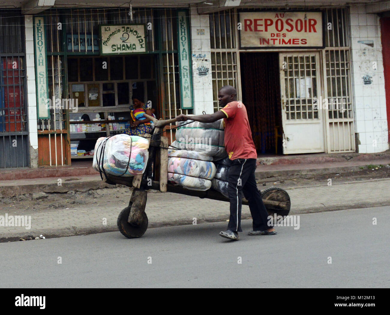 Chukudu is a traditional wooden bike transporting goods in Goma and ...