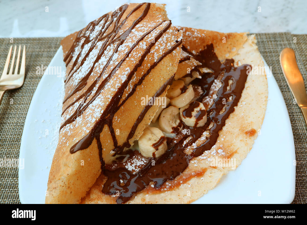 French Style Chocolate Banana Crape Served on White Plate Stock Photo ...