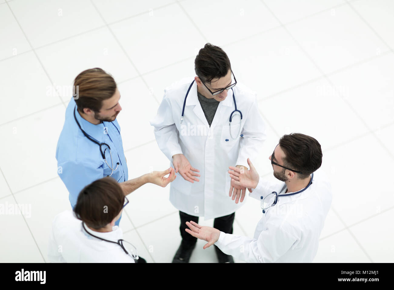 view from the top.a group of doctors discussing ideas Stock Photo - Alamy