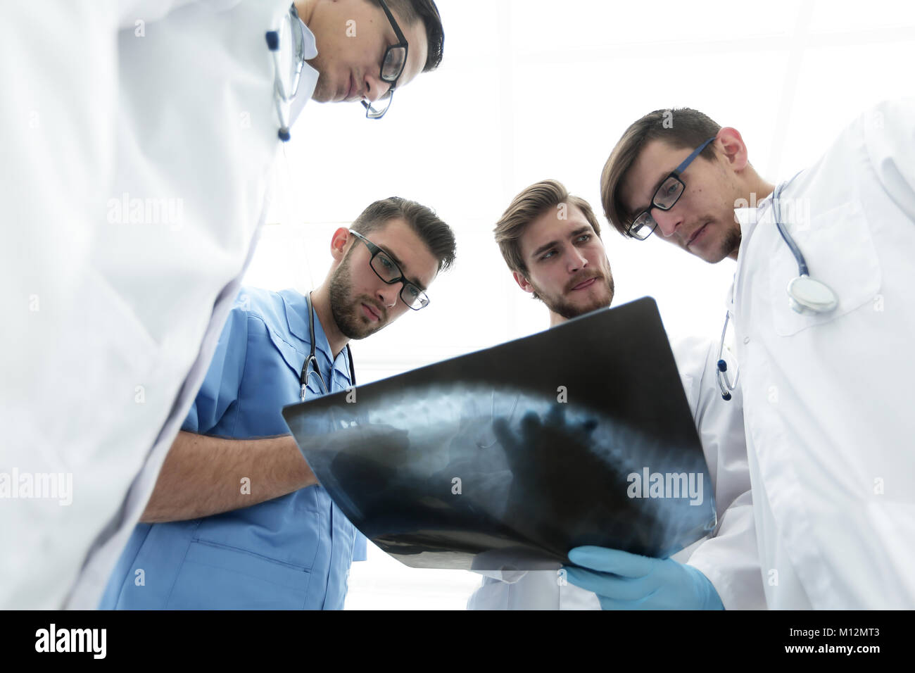 bottom view.team of doctors discussing an x-ray Stock Photo - Alamy