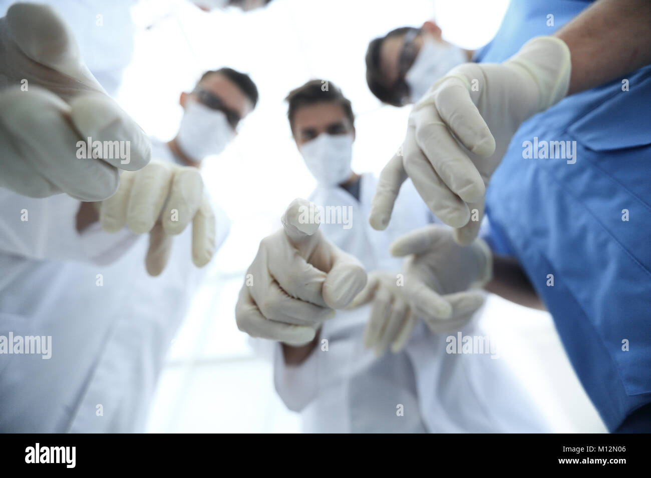 bottom view.a group of doctors in the operating room Stock Photo - Alamy