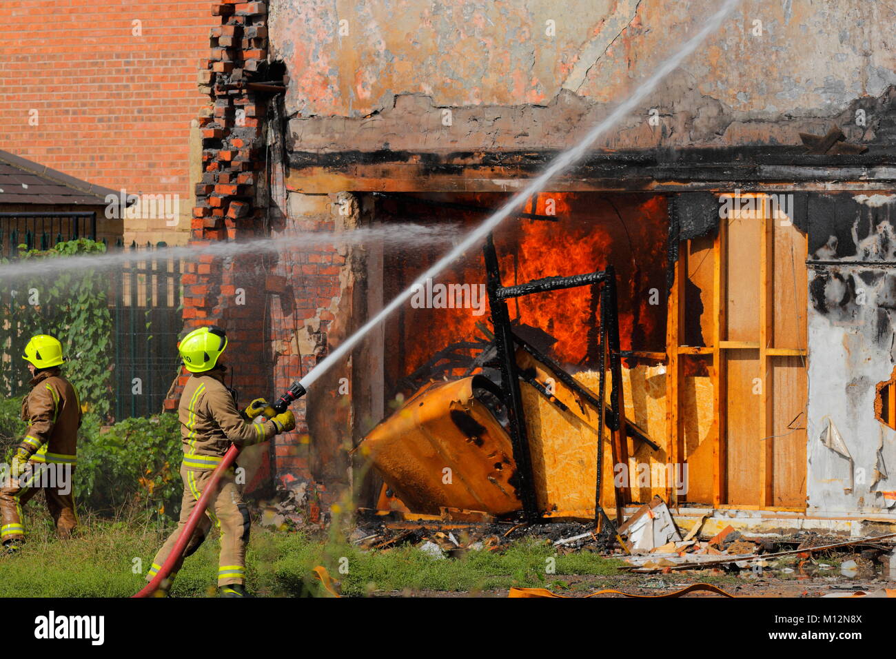 Fireman In Action Stock Photo - Alamy