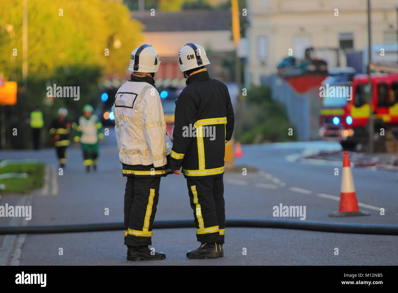 Fireman In Action Stock Photo - Alamy