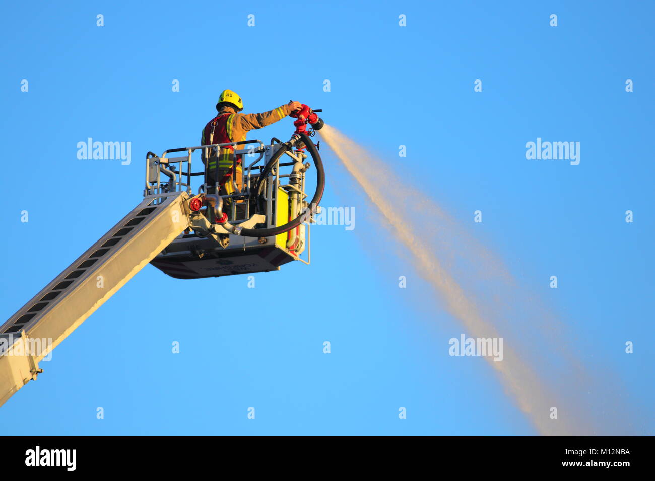 Fireman In Action Stock Photo - Alamy