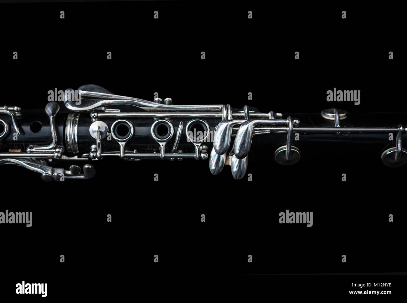 Close up of a clarinet lying down isolated in black Stock Photo - Alamy