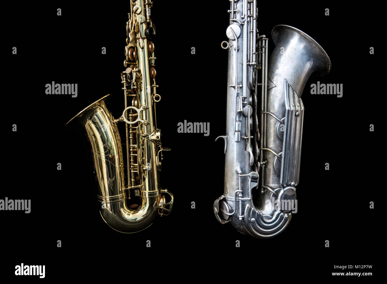 Close up of two saxophones standing isolated in black Stock Photo - Alamy