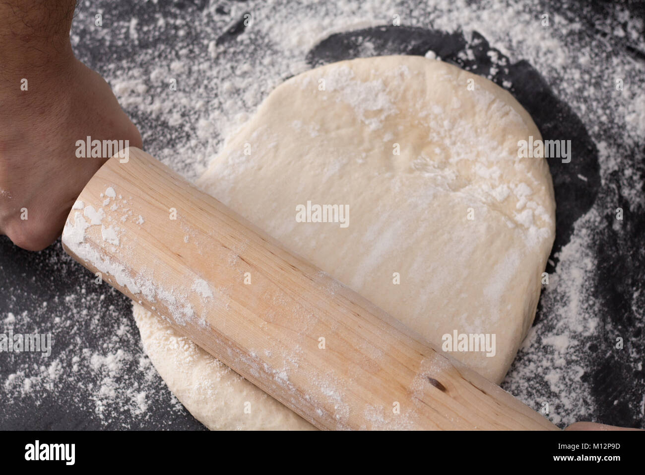 Rolling the dough, baking preparation closeup Stock Photo - Alamy